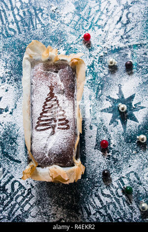 Chocolate banana bread decorated with a christmas tree on top , various ...