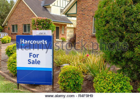 Estate agent signs advertising "New Build", "Sale Agreed" and "Sold ...