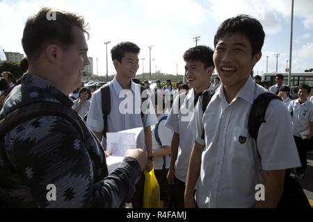 A student from Kubasaki High School receives ice cream at a barbeque in ...