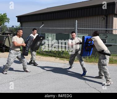 An Airman from the 166th Airlift Wing Civil Engineer Squadron lifts ...