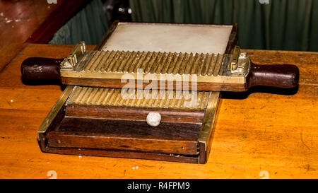 Historical pill maker Stock Photo - Alamy