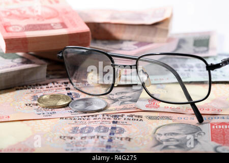 Indian money with spectacles Stock Photo - Alamy