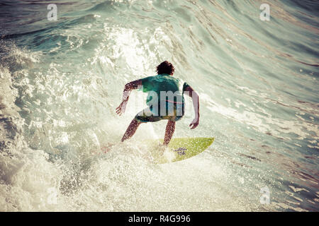Surfer Rides a Large Blue Tropical Wave in Paradise Stock Photo - Alamy