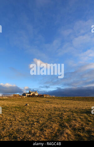 Low winter light in Hoswick Sandwick Shetland with homes around the ...