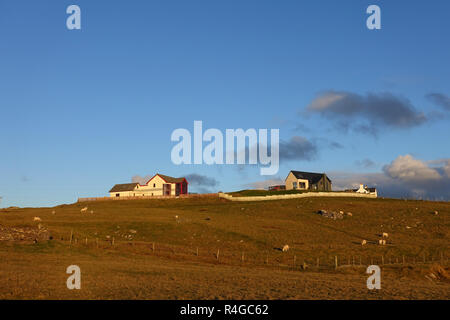 Low winter light in Hoswick Sandwick Shetland with homes around the ...