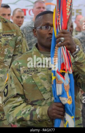 Command Sgt. Major Donald Madden hands the colors of the Georgia Army ...