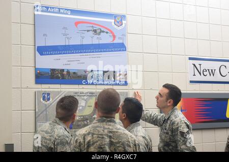 U.S. Airmen with the 156th Wing Mission Support Group render their ...