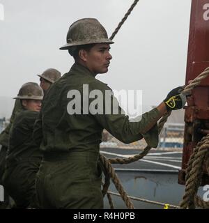 A marine aboard the aviation logistic ship USNS WRIGHT (T-AVB 3) looks ...