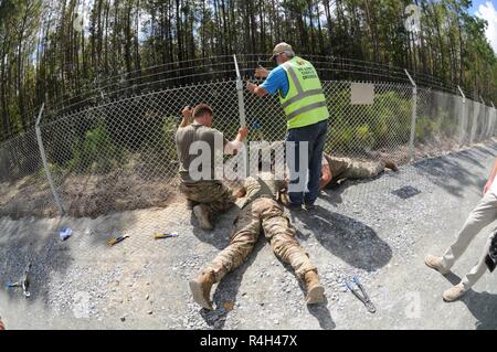 A soldier, with the 57th Sapper Company, 27th Engineering Battalion, is ...