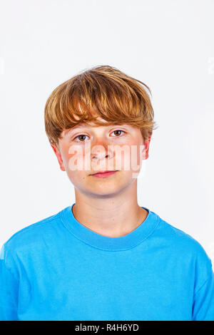 portrait of bold faced boy with white wall background Stock Photo - Alamy