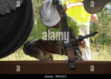 A high rail rotary dump truck from Civil Works Contracting, (CWC) dumps ...