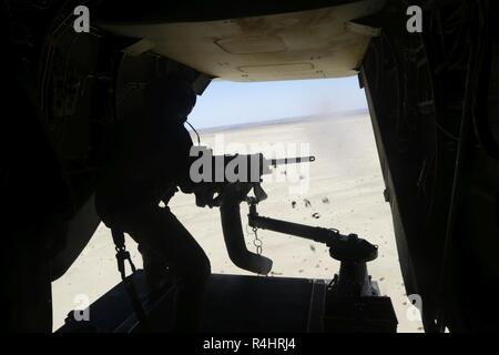 A U.S. Marine with the Advanced Machine Gun course fires a M240G medium ...