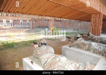 US Army Soldiers from NRDC Spain fire an M9 9mm pistol during ...