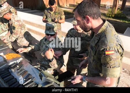 US Army Soldier from NRDC Spain fires an M9 9mm pistol during ...