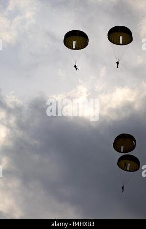 U.S. Army Paratroopers perform a static line jump during the Saturday ...
