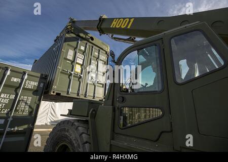 Container handler "Orion" handling overseas containers in the camp of ...