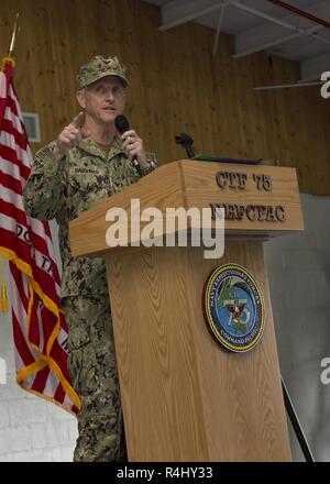 Capt. Robert A. Baughman gives his remarks during a change of command ...