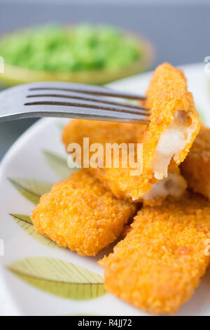 Golden roast Fish Sticks Fingers with sauce. Delicious fish finger ...