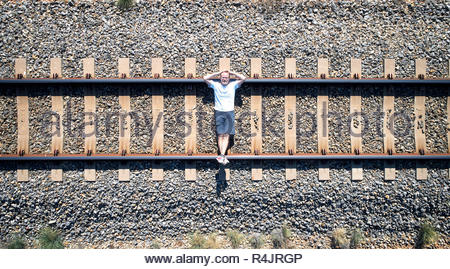 Man on rail tracks, loneliness Stock Photo: 24157368 - Alamy