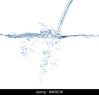 Water jet splashing against water surface against white background ...