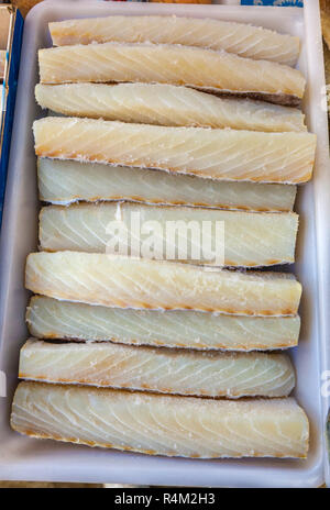 White salted and dried bacalao codfish in watertank, traditional ...