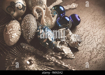 Beautiful christmas baubles on dark black background with medical Mask ...