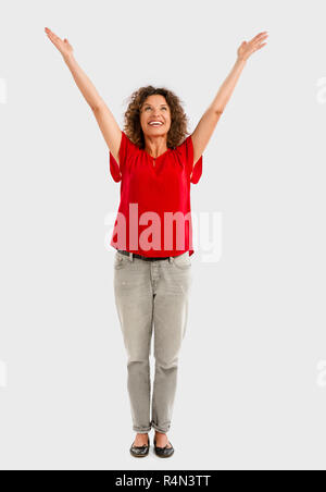 Full body photo of excited attractive lady sit floor arms hold show ...