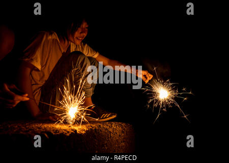 Kids Playing Fireworks Stock Photo - Alamy