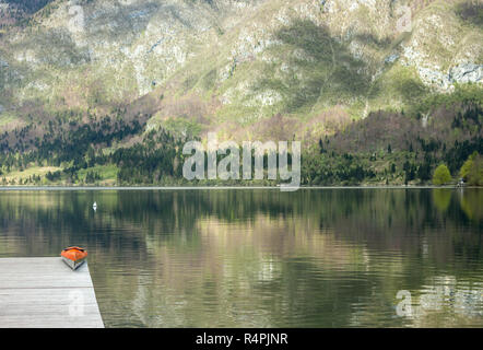 Mountain lake orange kayak crystal clear water Stock Photo - Alamy
