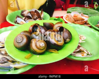 Vietnamese steamed snails on dish for street food Stock Photo - Alamy