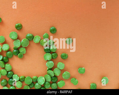 Green split peas, complementary colors Stock Photo - Alamy