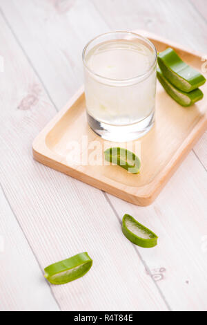 Aloe vera yogurt with fresh leaves on a wooden table Stock Photo - Alamy