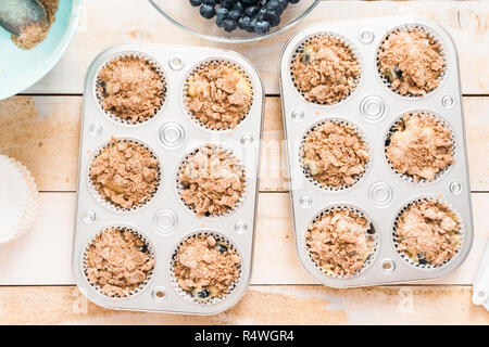 Flat lay. Blueberry muffin batter in muffin metal pan Stock Photo - Alamy