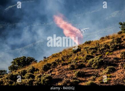 Slurry bombers (planes and jets) fight wildfires from the air by ...