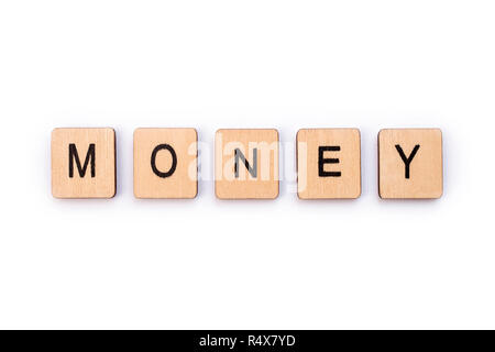 The word MONEY spelt with wooden letter tiles Stock Photo - Alamy