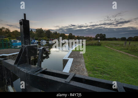 Lock gates on the river Nene near the Northampton boat club on a dull ...