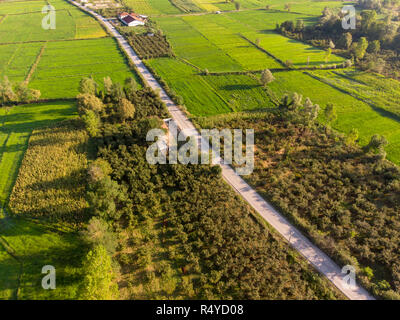 A aerial view of greenfield with shadows and a path Stock Photo - Alamy