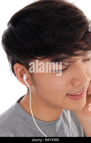 Delighted handsome man playing online game on mobile phone isolated ...