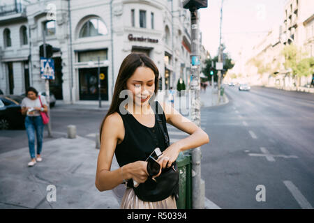 A beautiful young girl is standing at a crossroads Stock Photo - Alamy