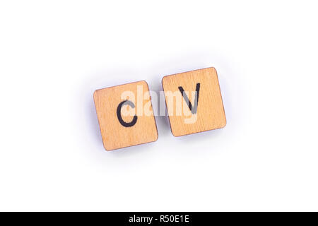 The abbreviation CV - Curriculum Vitae, spelt with wooden letter tiles ...
