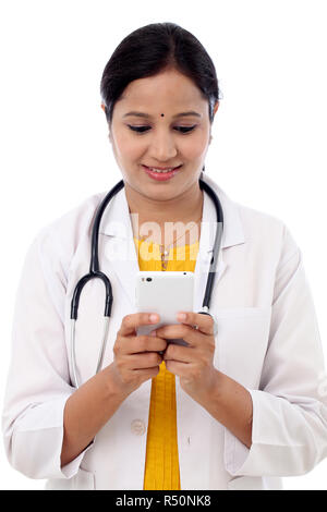 Female doctor text messaging Stock Photo - Alamy