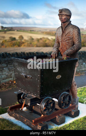 Restored lead mining tub and sculpture of miner, Rowley Bank ...