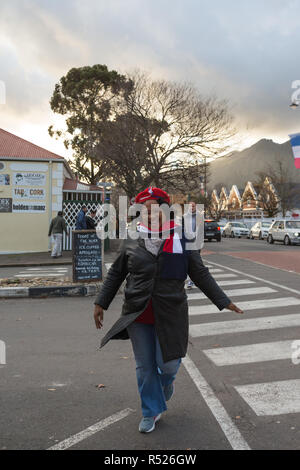 African Woman Wearing a Black and Red Latex Fetish Outfit and Holding a ...
