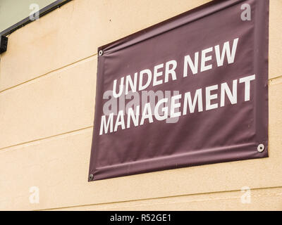 "Under New Management" banner sign on the outside exterior external ...