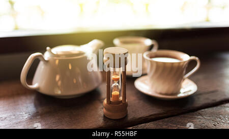 Cup of tea with hourglass Stock Photo - Alamy