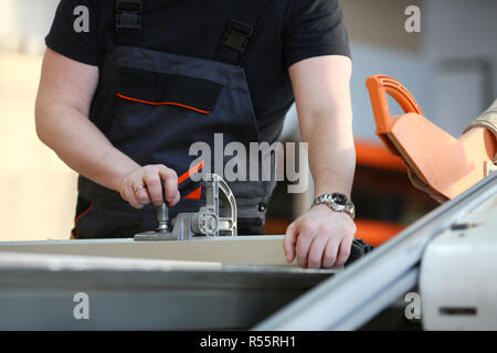 Worker using electric saw portrait Stock Photo - Alamy