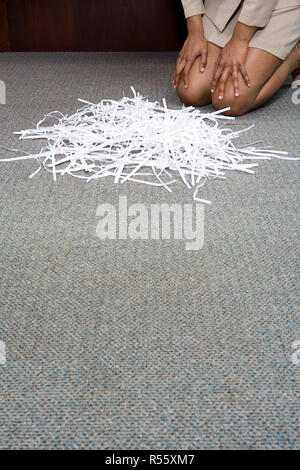 Woman shredding paper Stock Photo - Alamy
