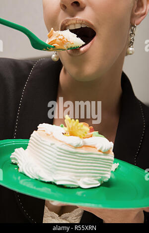 Cropped unrecognizable delighted young female in sleepwear sitting on ...