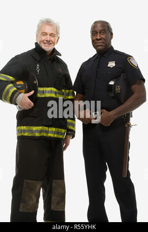 Image of happy male firefighter with helmet in his hands against ...