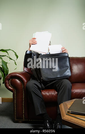 Unrecognizable businessman holding paper covering her face Stock Photo ...